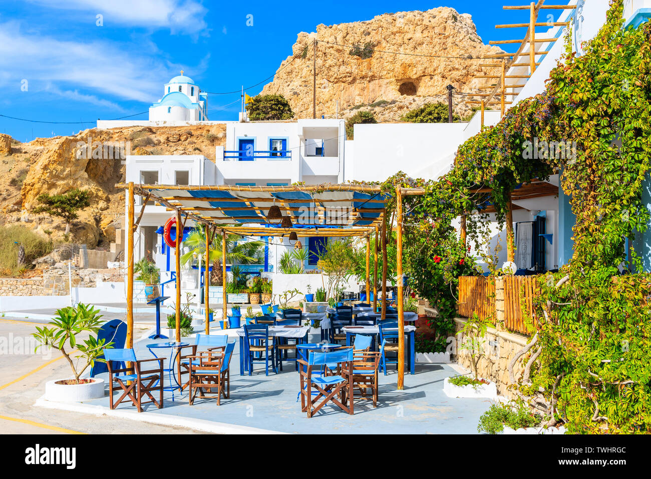 Tables and chairs in traditional Greek taverna in Finiki port on ...