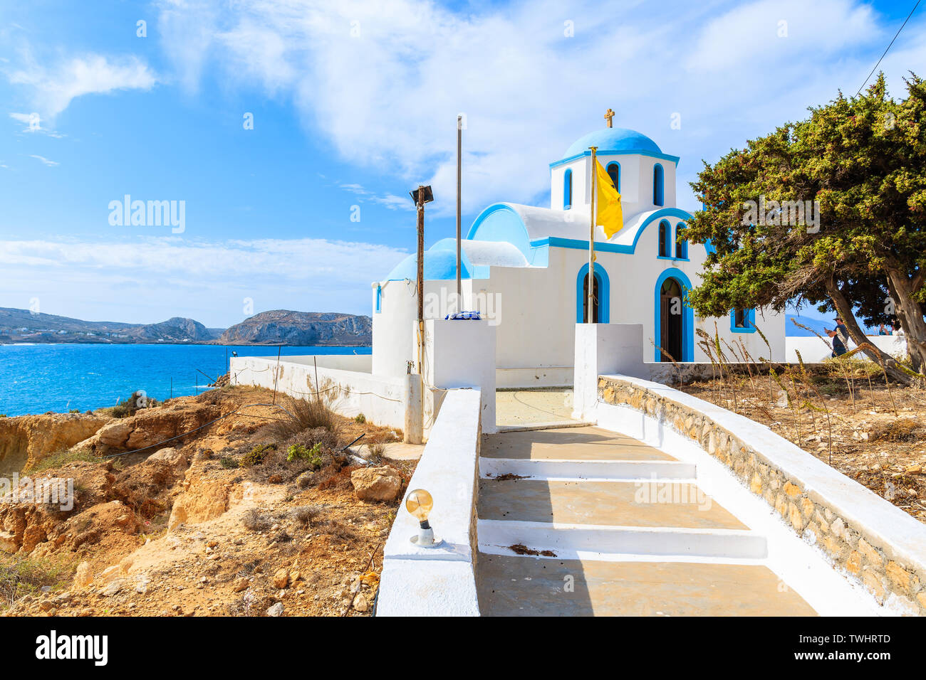 Steps to traditional white church in Finiki port, Karpathos island ...