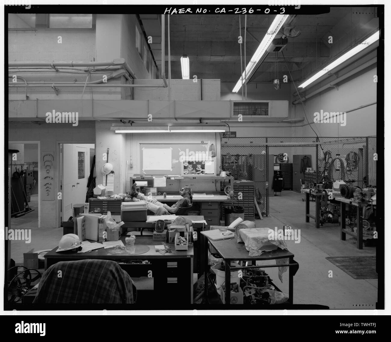 SHOP AREA. Looking west into storage cage from near northeast corner of ...