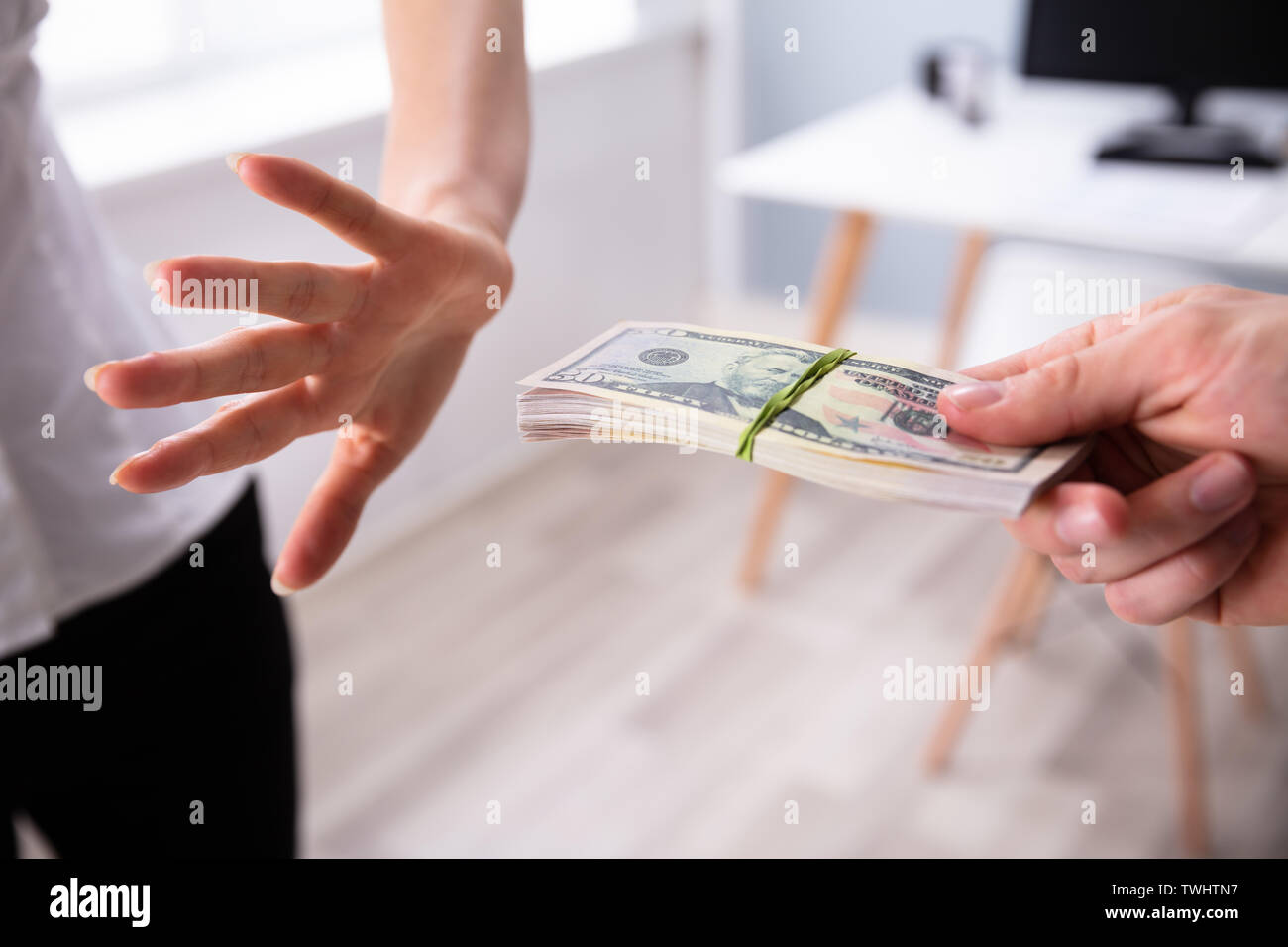 Close-up Woman's Hand Refusing To Take Bribe From Man Stock Photo - Alamy