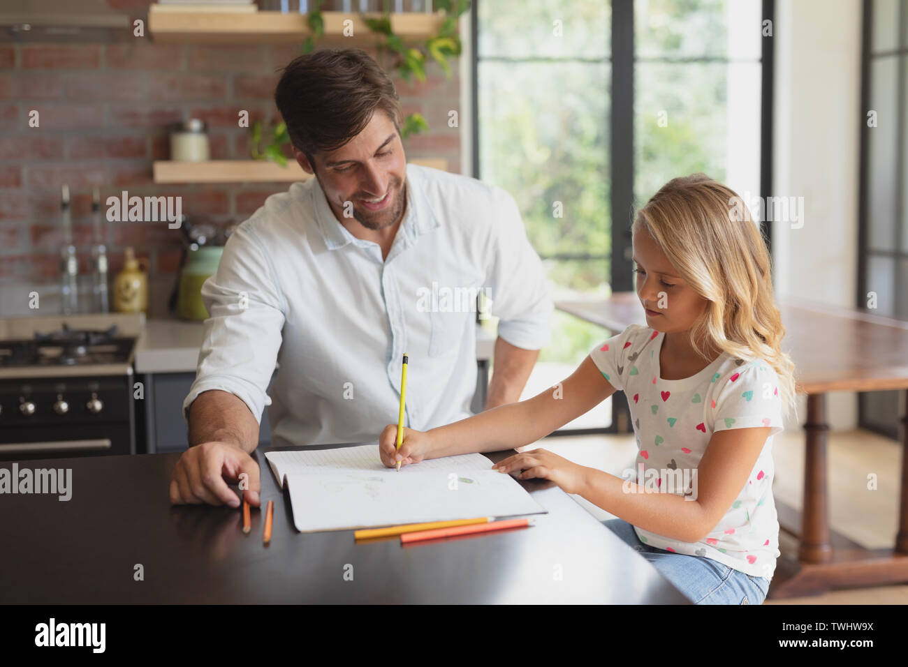 Father helping daughter homework in hi-res stock photography and images ...
