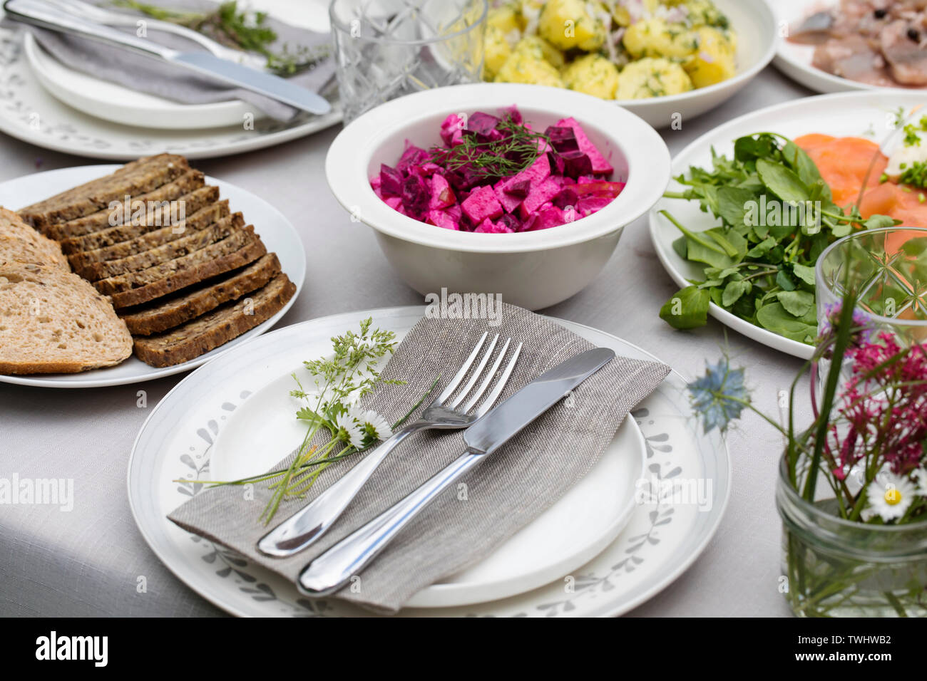 Table setting for midsummer party Stock Photo - Alamy