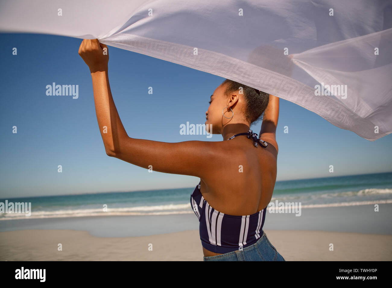 Waving man on beach hi-res stock photography and images - Alamy