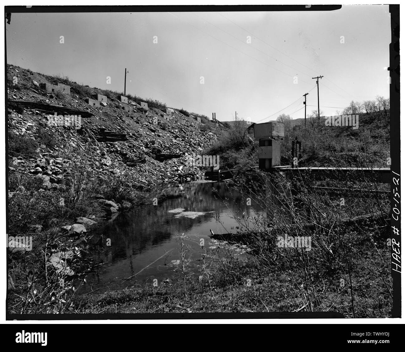 SIDE VIEW; DOWNSTREAM FACE OF DAM WITH SEEPAGE POND IN FOREGROUND ...