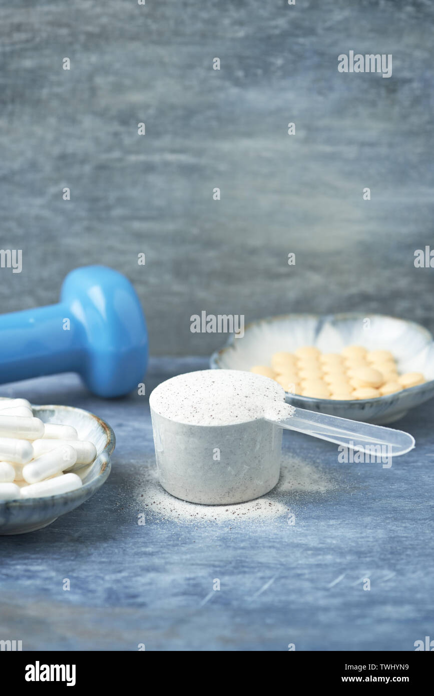 Collagen powder, Proline capsules and Vitamin C tablets. Sports ...