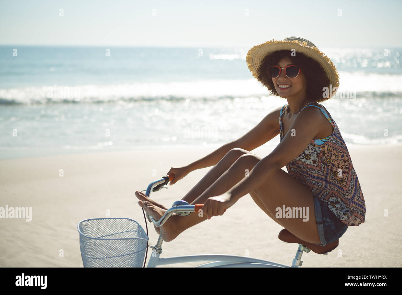 Young black woman riding bicycle hi-res stock photography and images ...