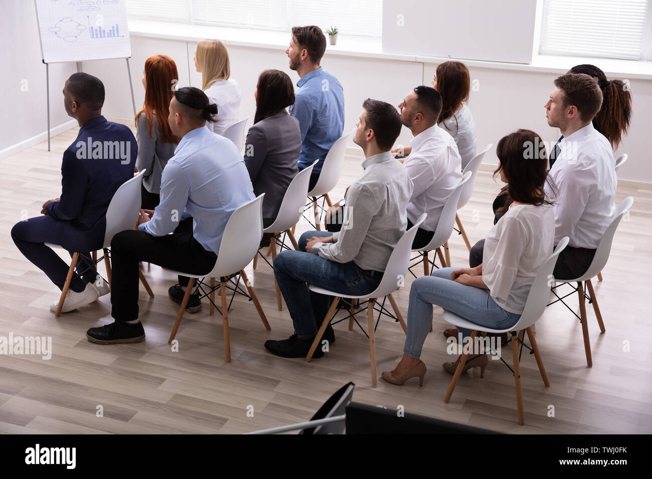 Diverse Group Of Successful Business People Sitting On Chair In The ...