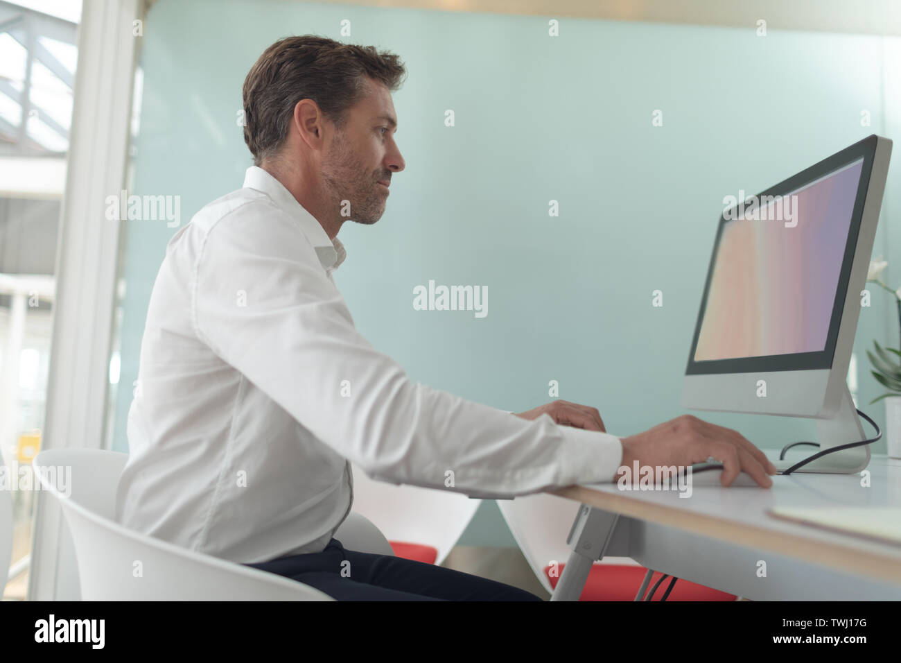 Male executive working on computer hi-res stock photography and images ...