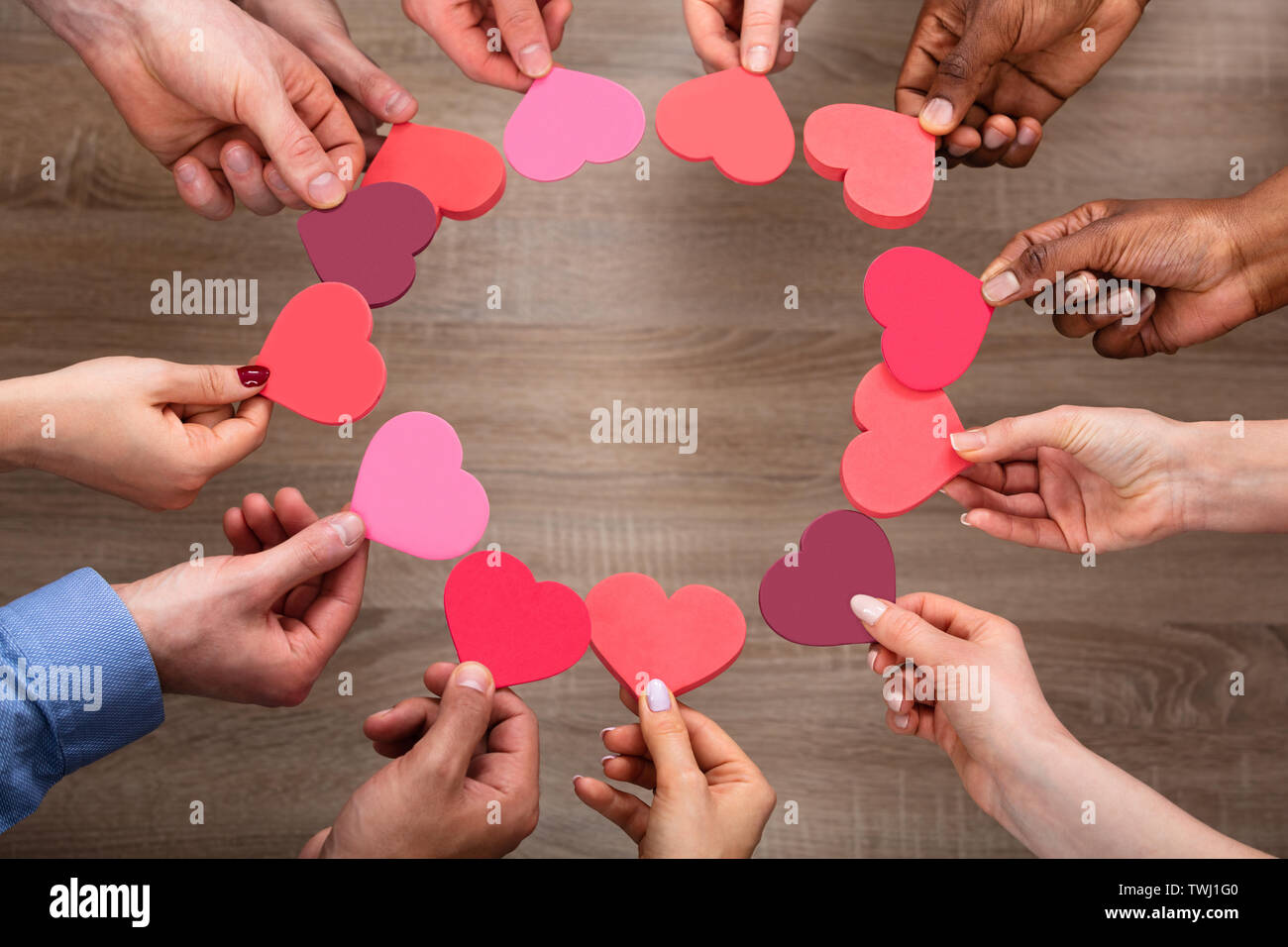Group of people making heart symbol hi-res stock photography and images ...