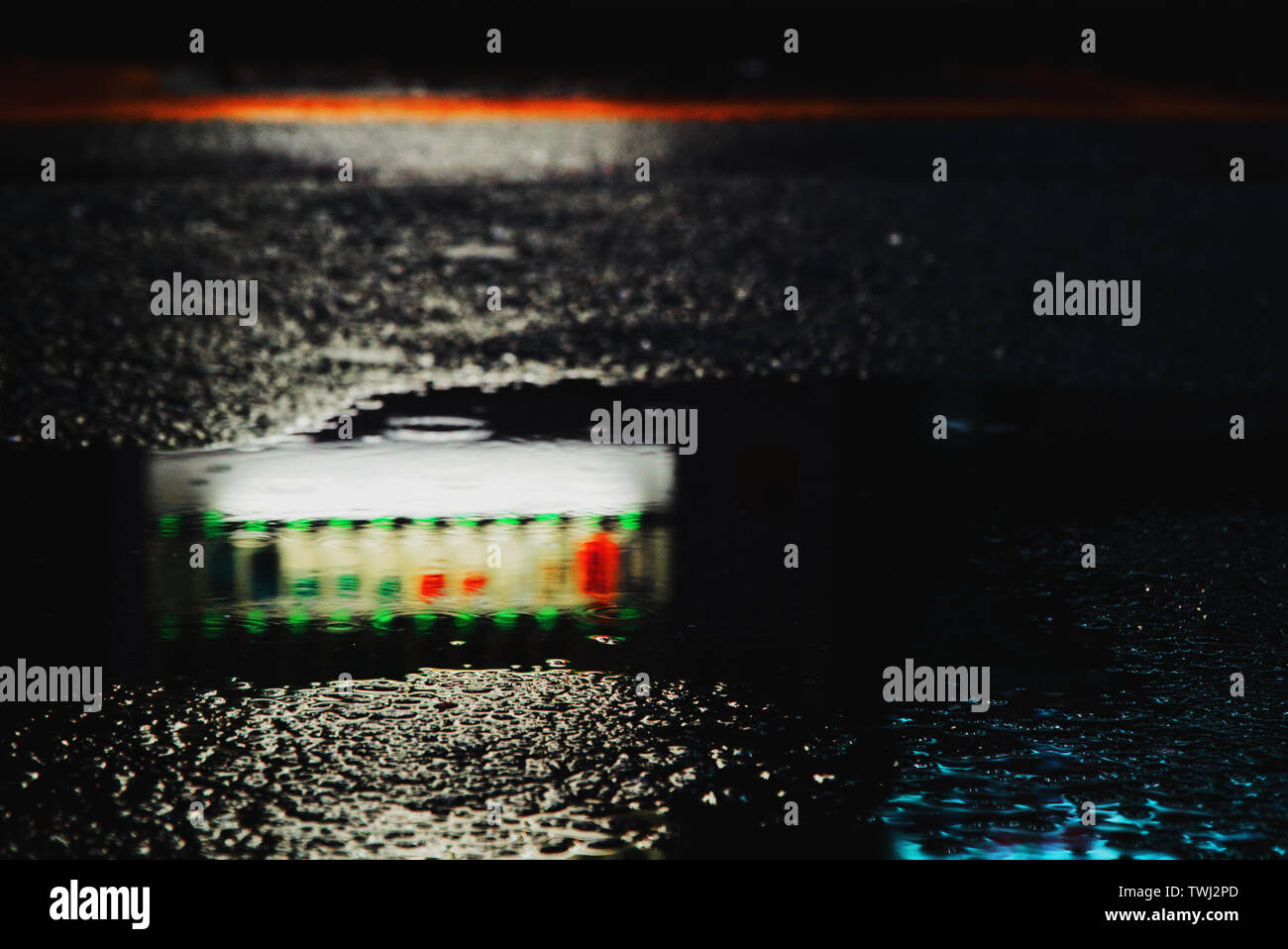 Neon sign reflecting in puddle hi-res stock photography and images - Alamy