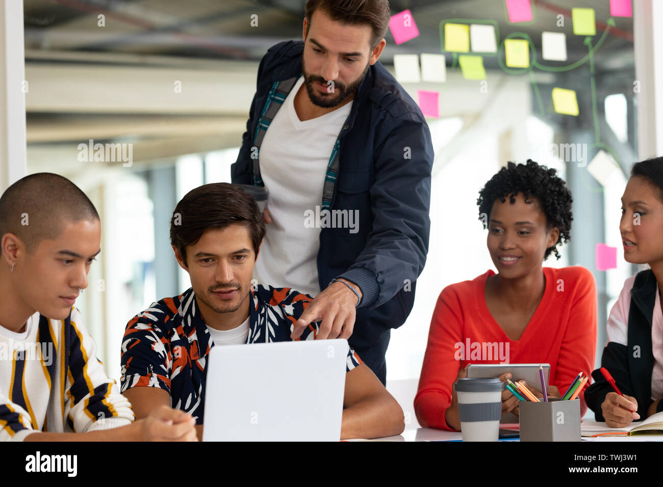 Business people discussing over laptop in the conference room Stock ...