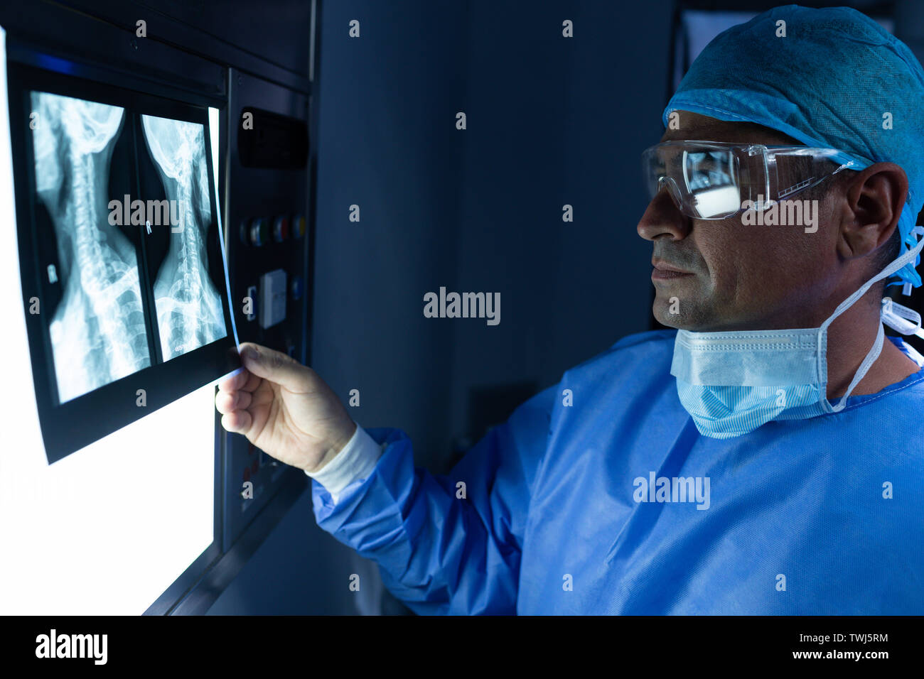 Male surgeon reading x ray in operating room at hospital Stock Photo ...