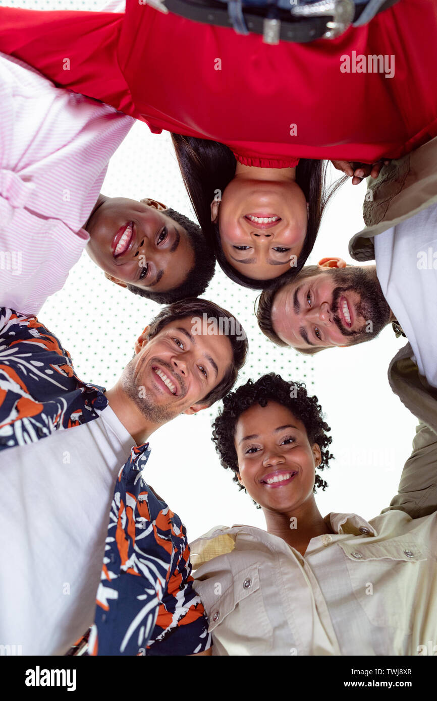 Business people standing in huddle in a modern office Stock Photo - Alamy