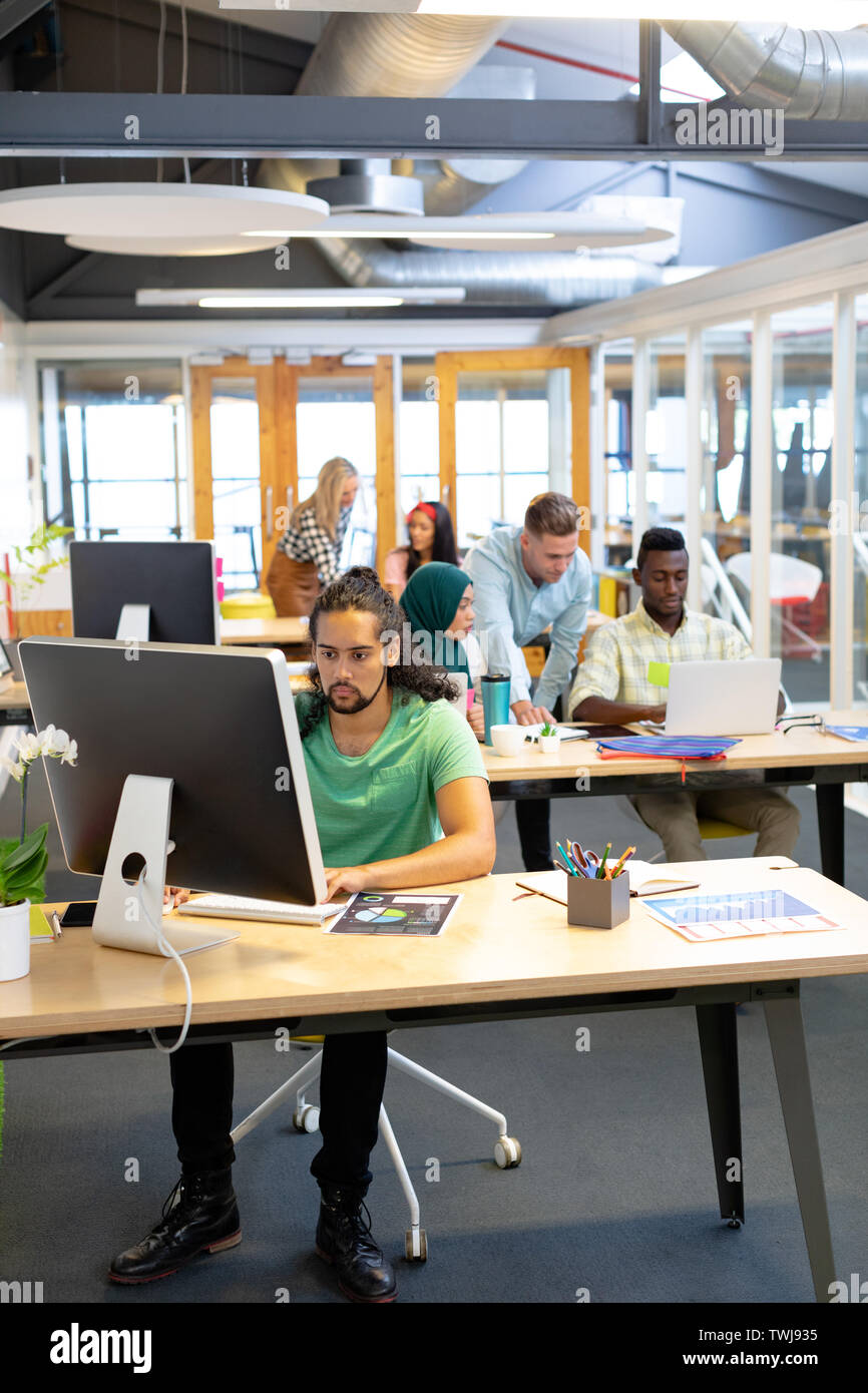 Business people working at desk in a modern office Stock Photo - Alamy