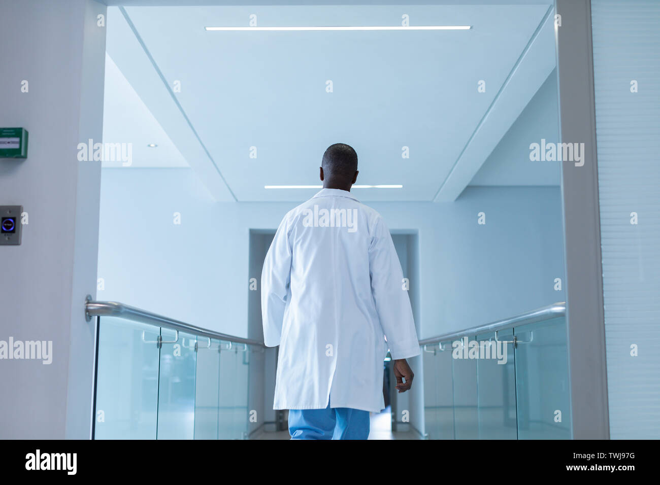 Black doctor walking hi-res stock photography and images - Alamy
