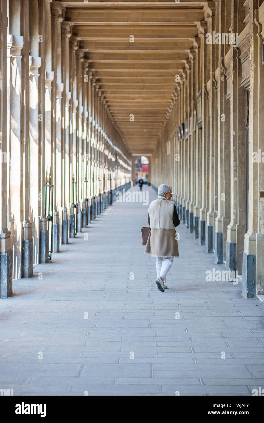 Paris, France - April 12, 2019 : Senior woman with beige clothing ...