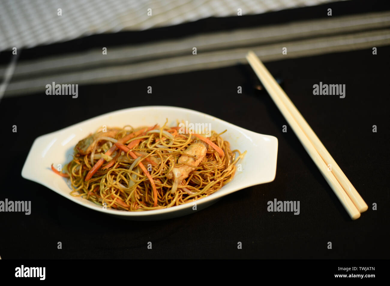 Chinese fried noodle, setup nicely on table ready to serve Stock Photo ...