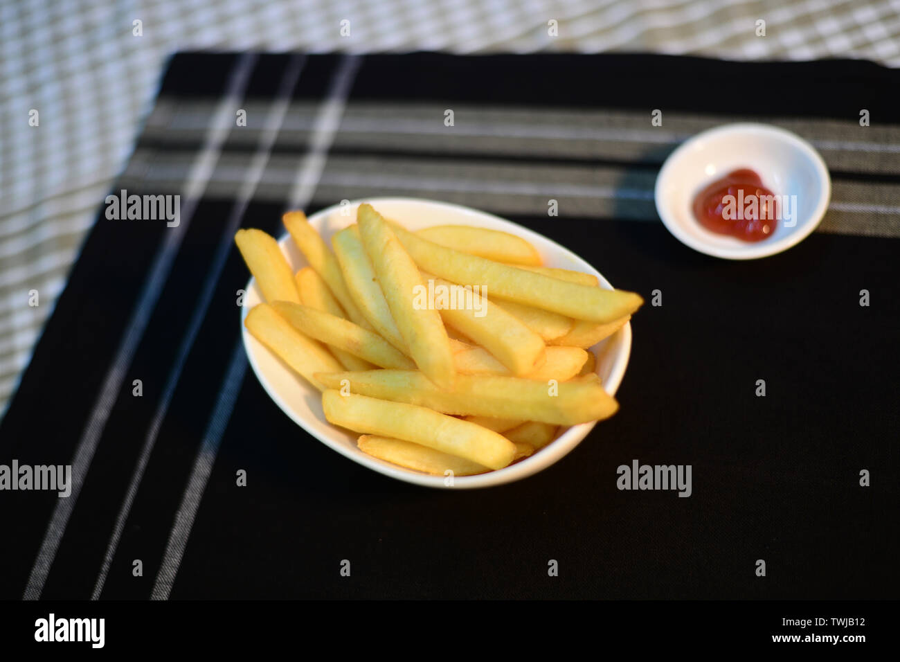 Crispy potato chips, setup nicely on table ready to serve Stock Photo ...