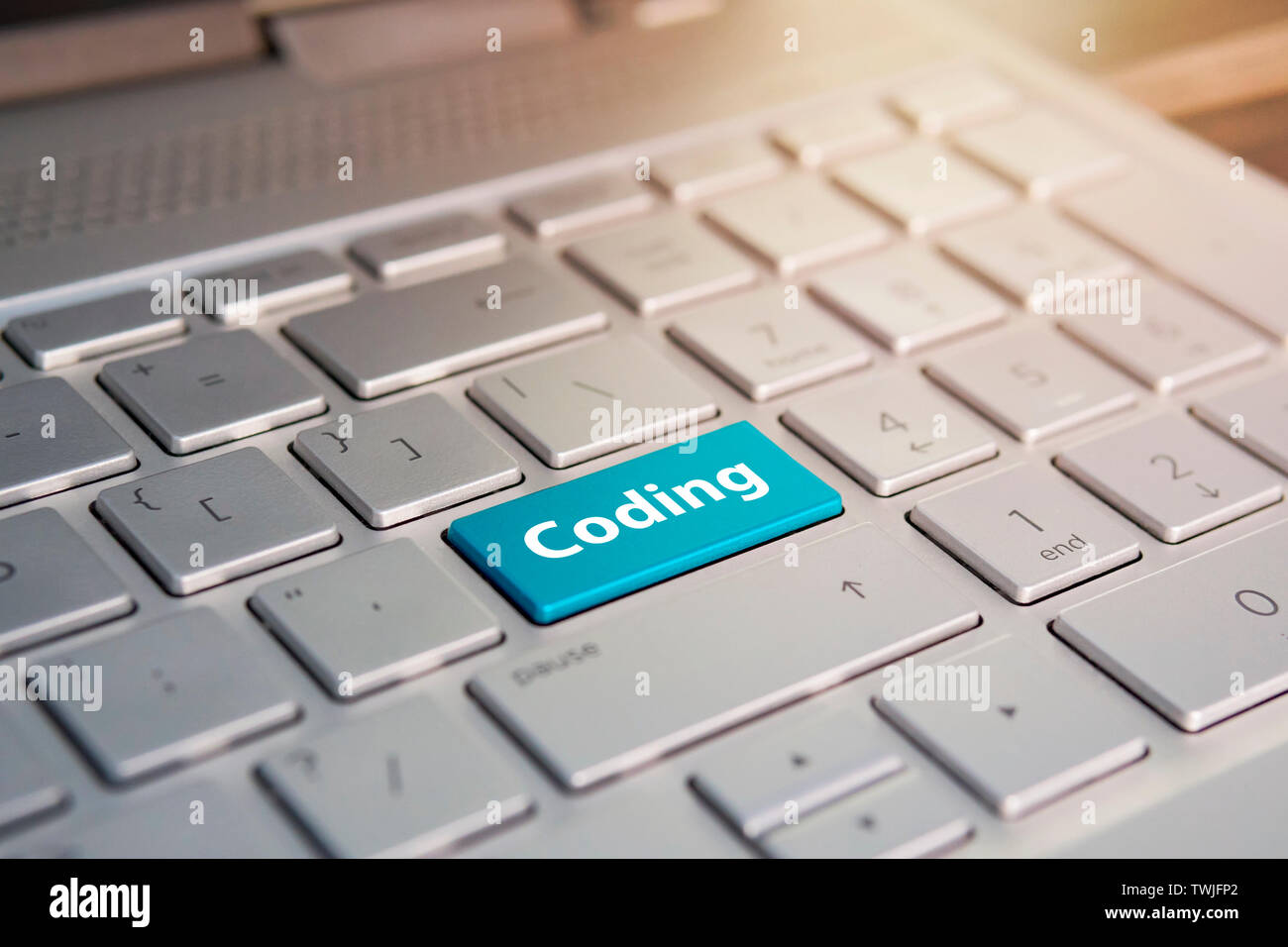 push button. blue button on grey silver laptop keyboard. copy space to ...