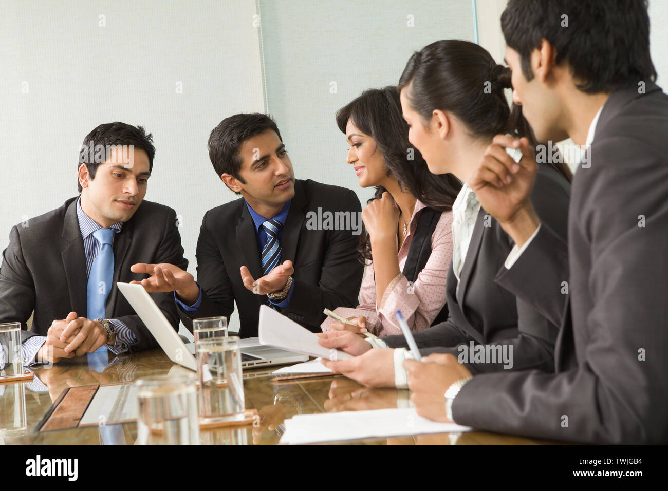 Business executives in an office meeting Stock Photo - Alamy