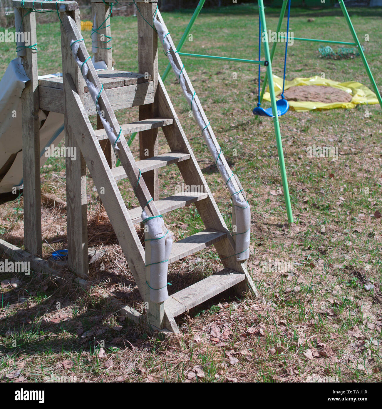 Outdoor shot of a handmade wooden children slide , square composition ...