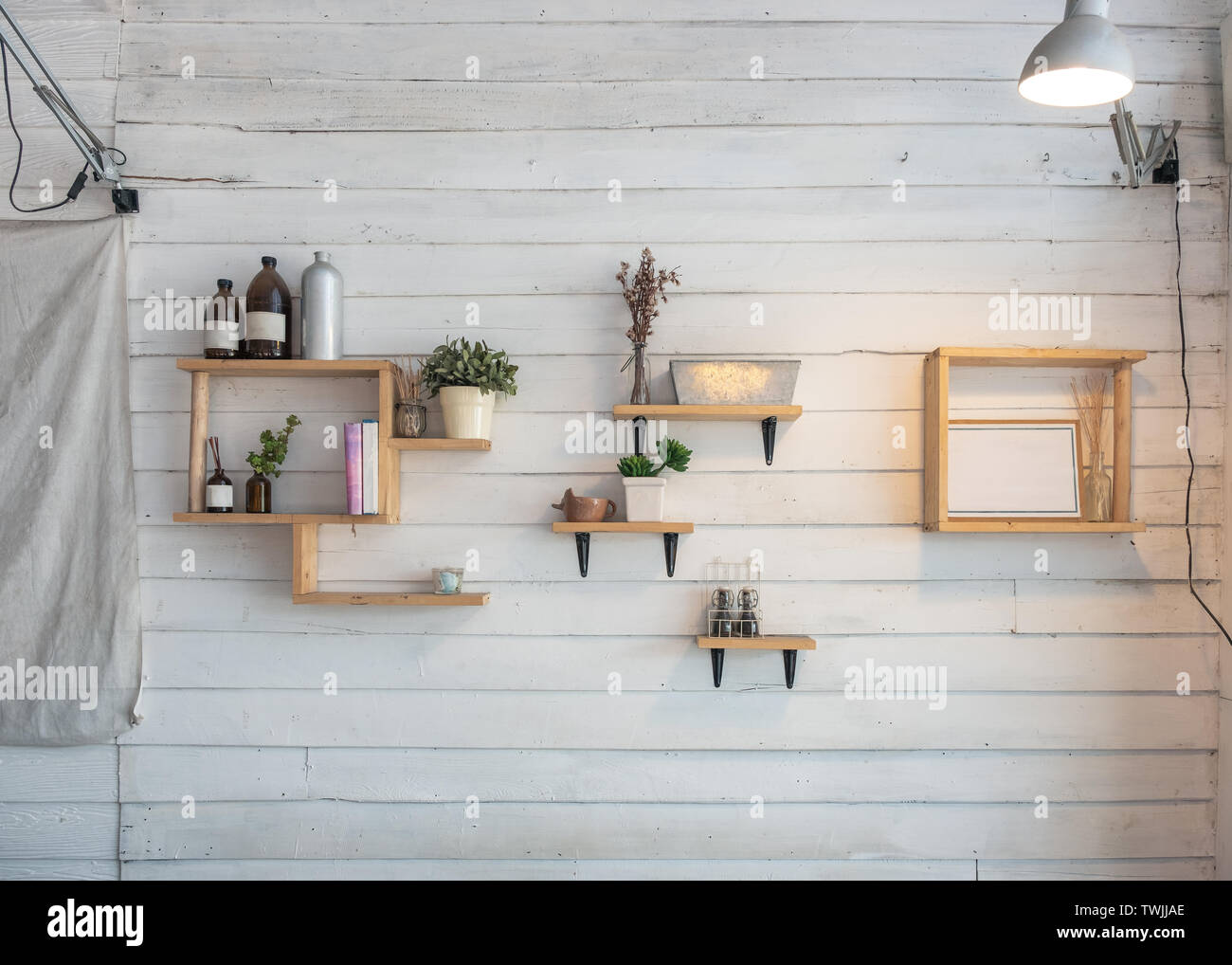 Interior design of wooden shelf with art object decoration on wall ...