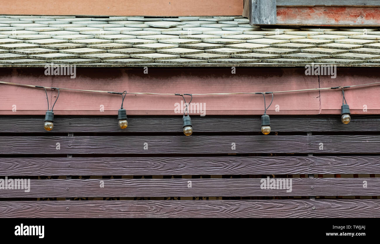 Exterior roof with lamp decorative on wooden wall Stock Photo - Alamy