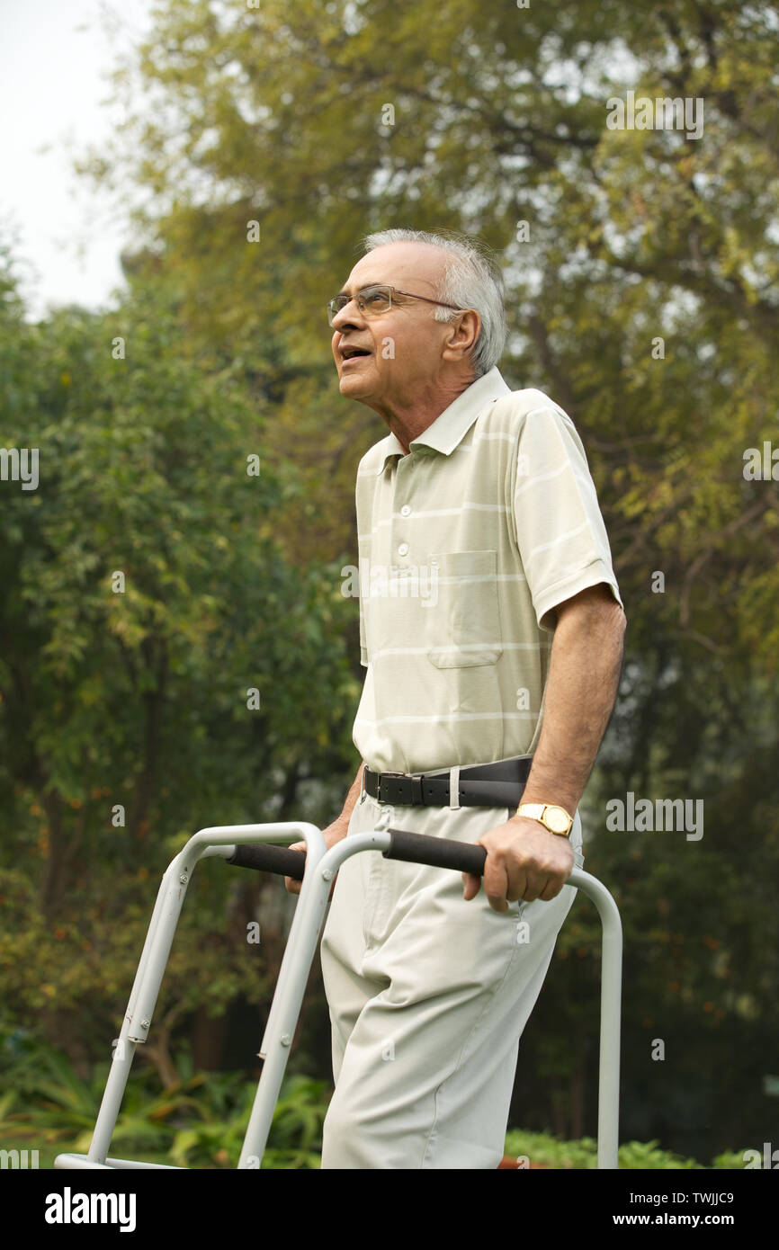 Elderly person walking on a zimmer frame hi-res stock photography and ...