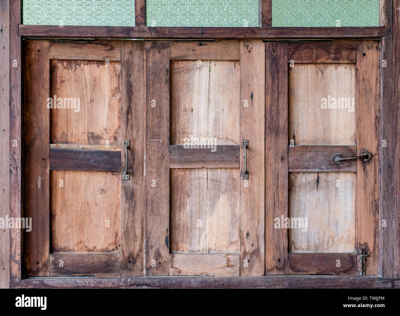 Aged wooden windows closed with glass pattern Stock Photo - Alamy