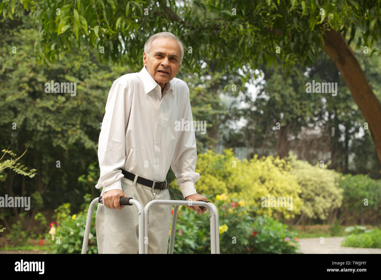 Indian old man walking walker hi-res stock photography and images - Alamy