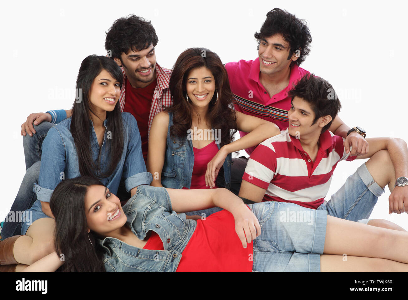 Group of friends sitting together Stock Photo - Alamy