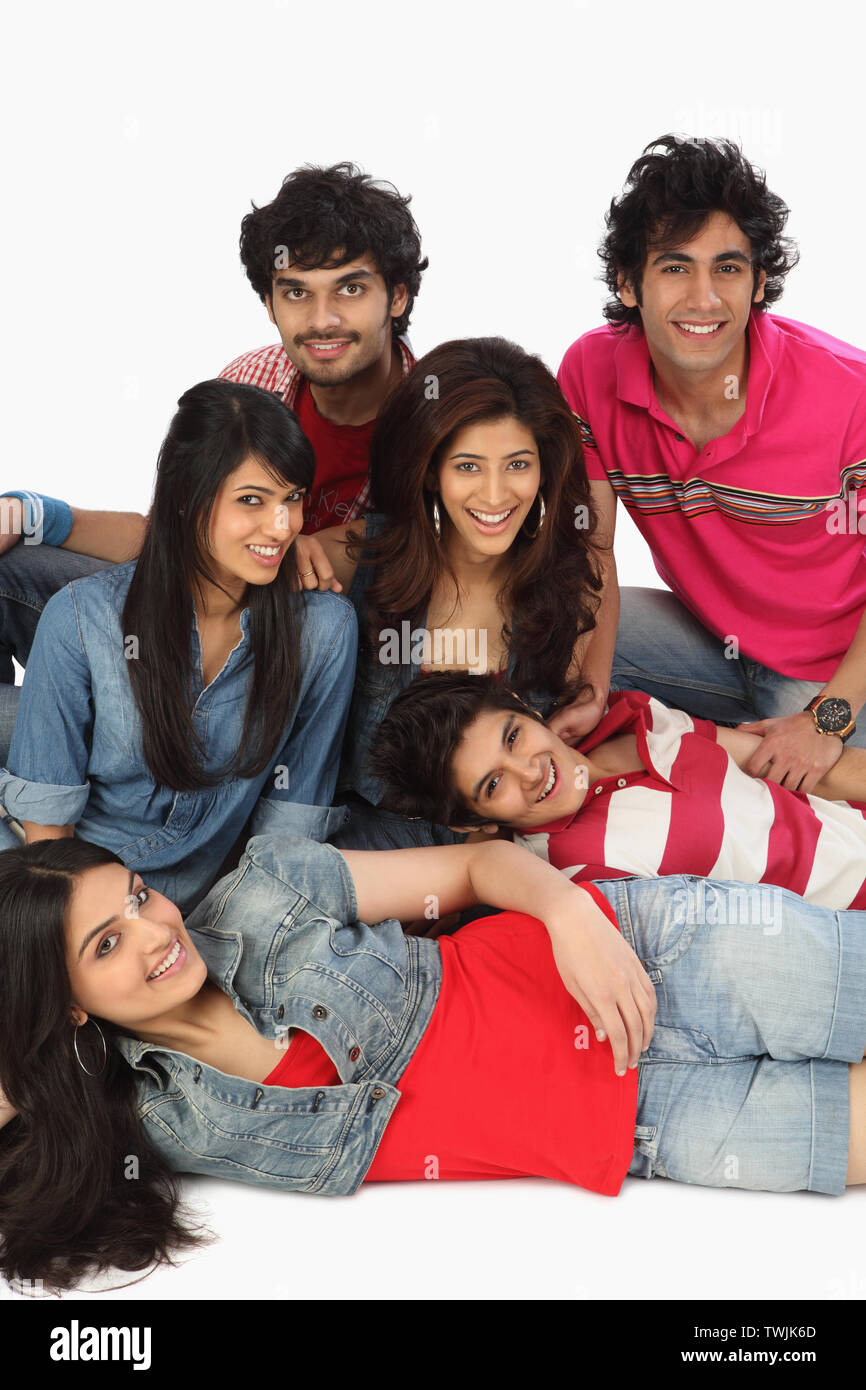Group of friends sitting together Stock Photo - Alamy