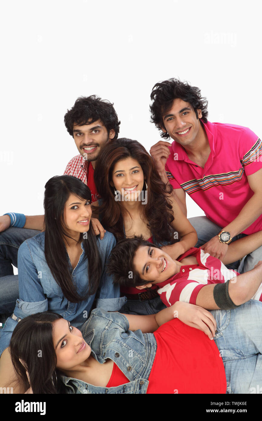 Group of friends sitting together Stock Photo - Alamy