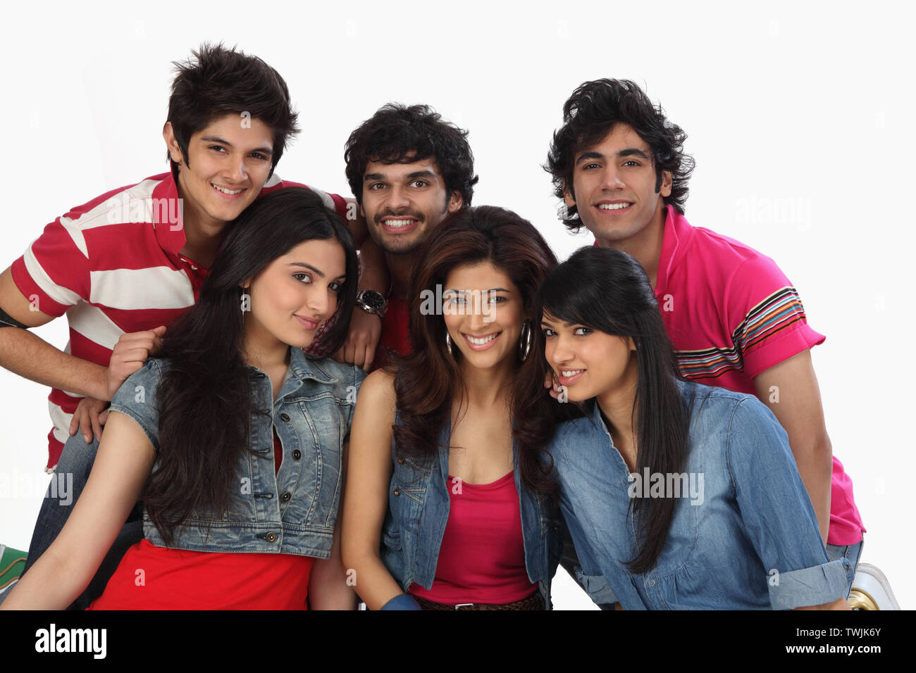 Group of friends sitting together Stock Photo - Alamy