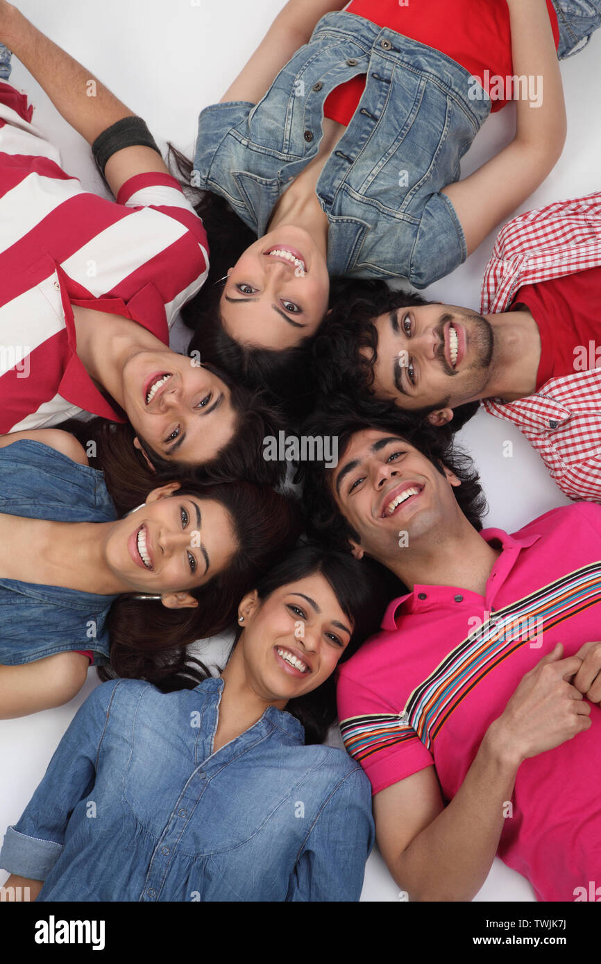 High angle view of group of friends lying down Stock Photo - Alamy