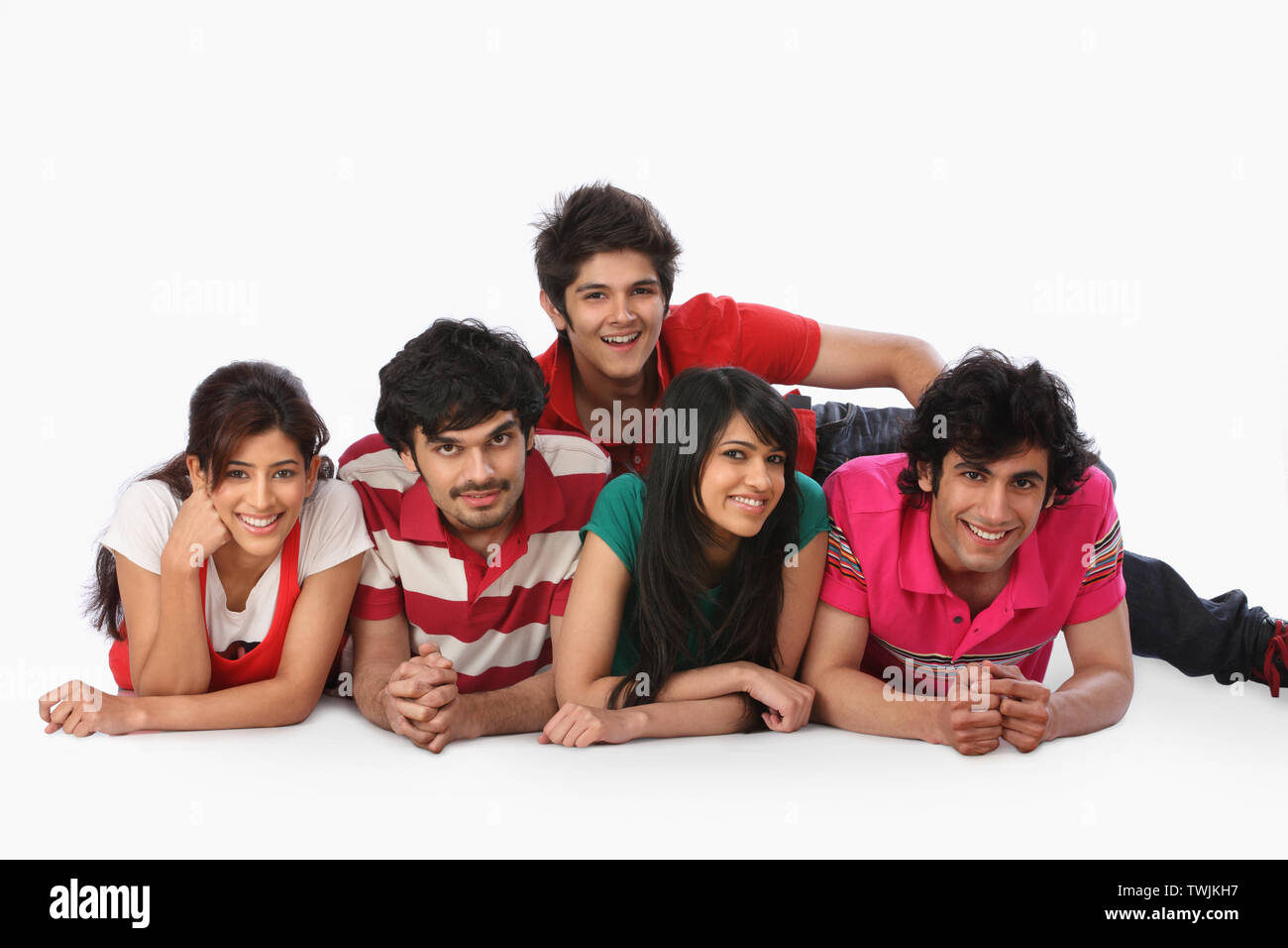 Group of friends lying down Stock Photo - Alamy