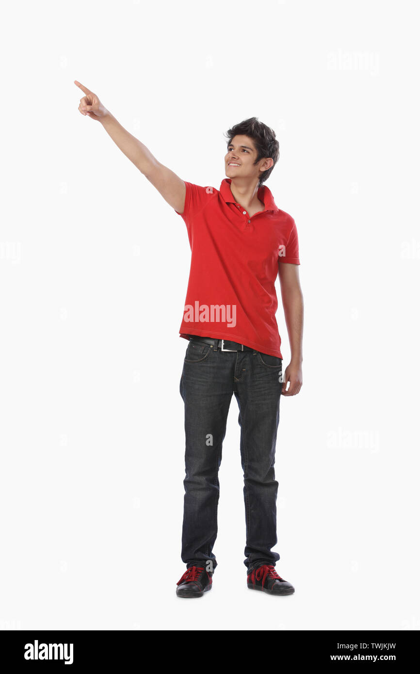 Man pointing upward and smiling Stock Photo - Alamy