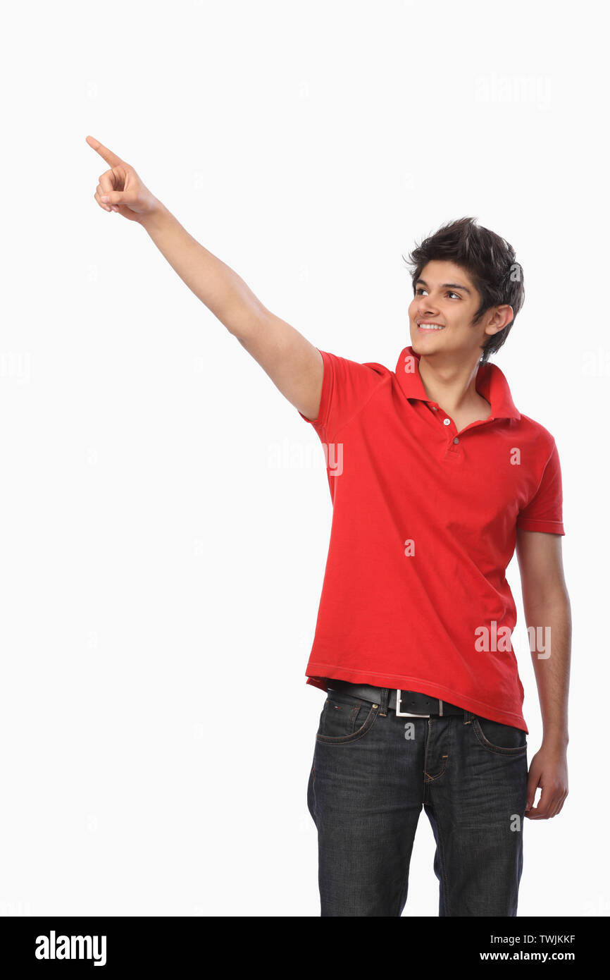 Man pointing upward and smiling Stock Photo - Alamy