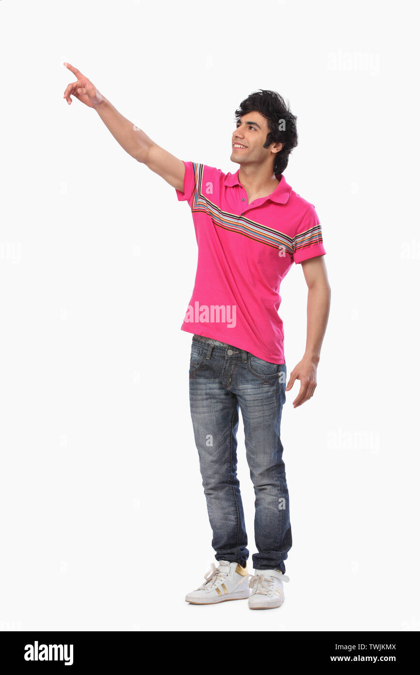 Man pointing upward and smiling Stock Photo - Alamy