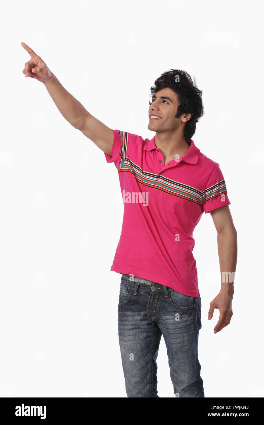 Man pointing upward and smiling Stock Photo - Alamy