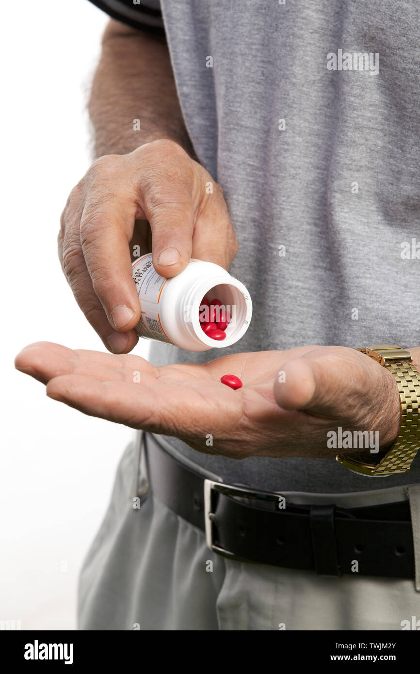 Old man pouring prescription medication into hand Stock Photo - Alamy