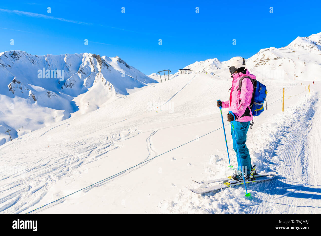Woman skier on slope in amazing Austrian Alps in beautiful winter ...