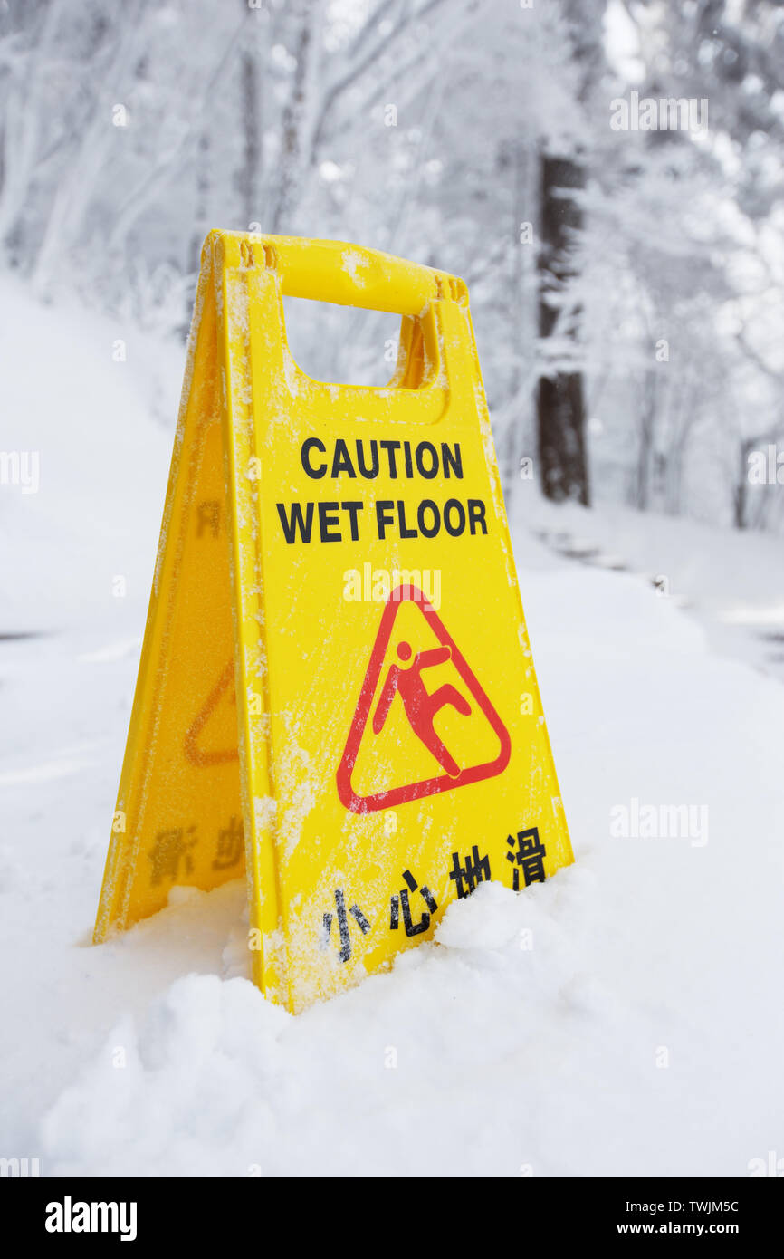 warning caution sign board on snow floor on hill Stock Photo - Alamy