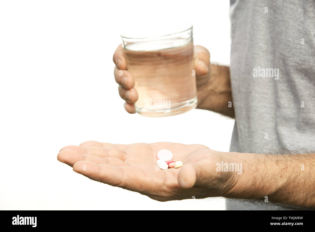 Indian old man taking medicine hi-res stock photography and images - Alamy