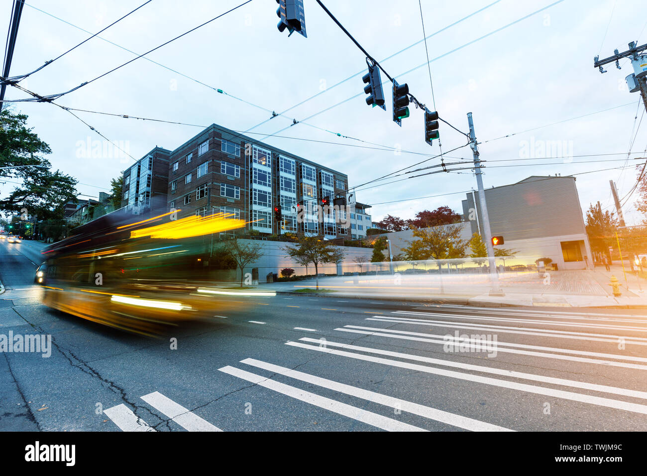 blur moving bus at road intersection in seattle Stock Photo - Alamy