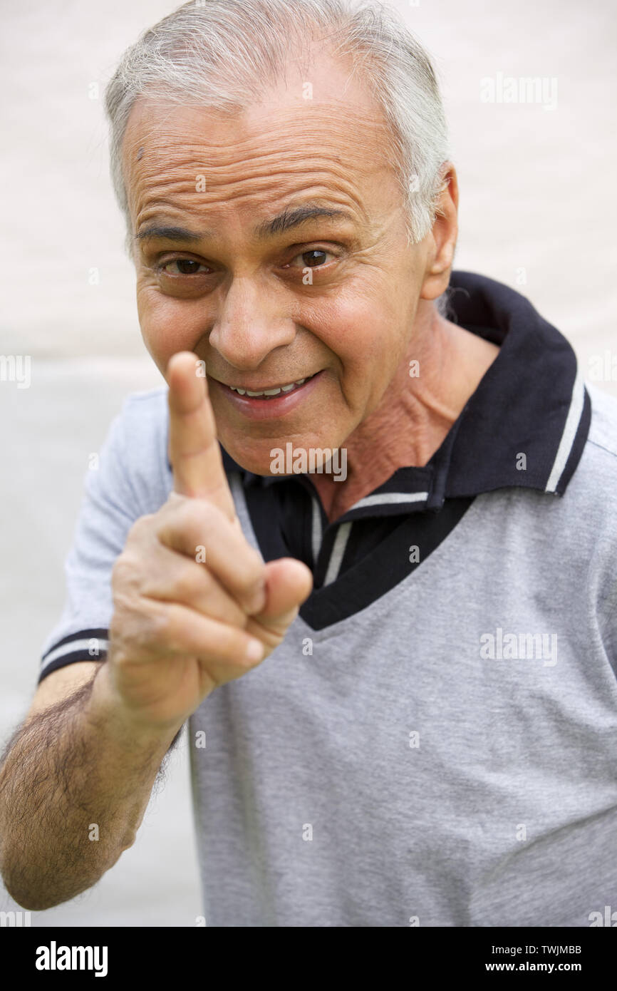 Elderly indian man pointing finger hi-res stock photography and images ...