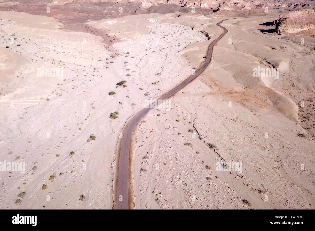 Old Desert road with cracked asphalt, Top down aerial image Stock Photo ...