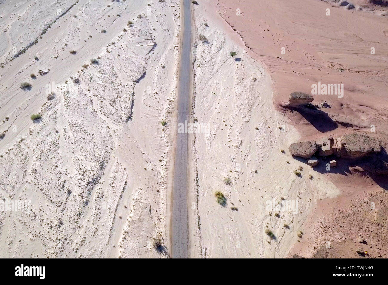 Old Desert road with cracked asphalt, Top down aerial image Stock Photo ...