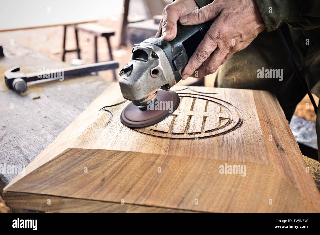 Wood worker carving wood Stock Photo - Alamy