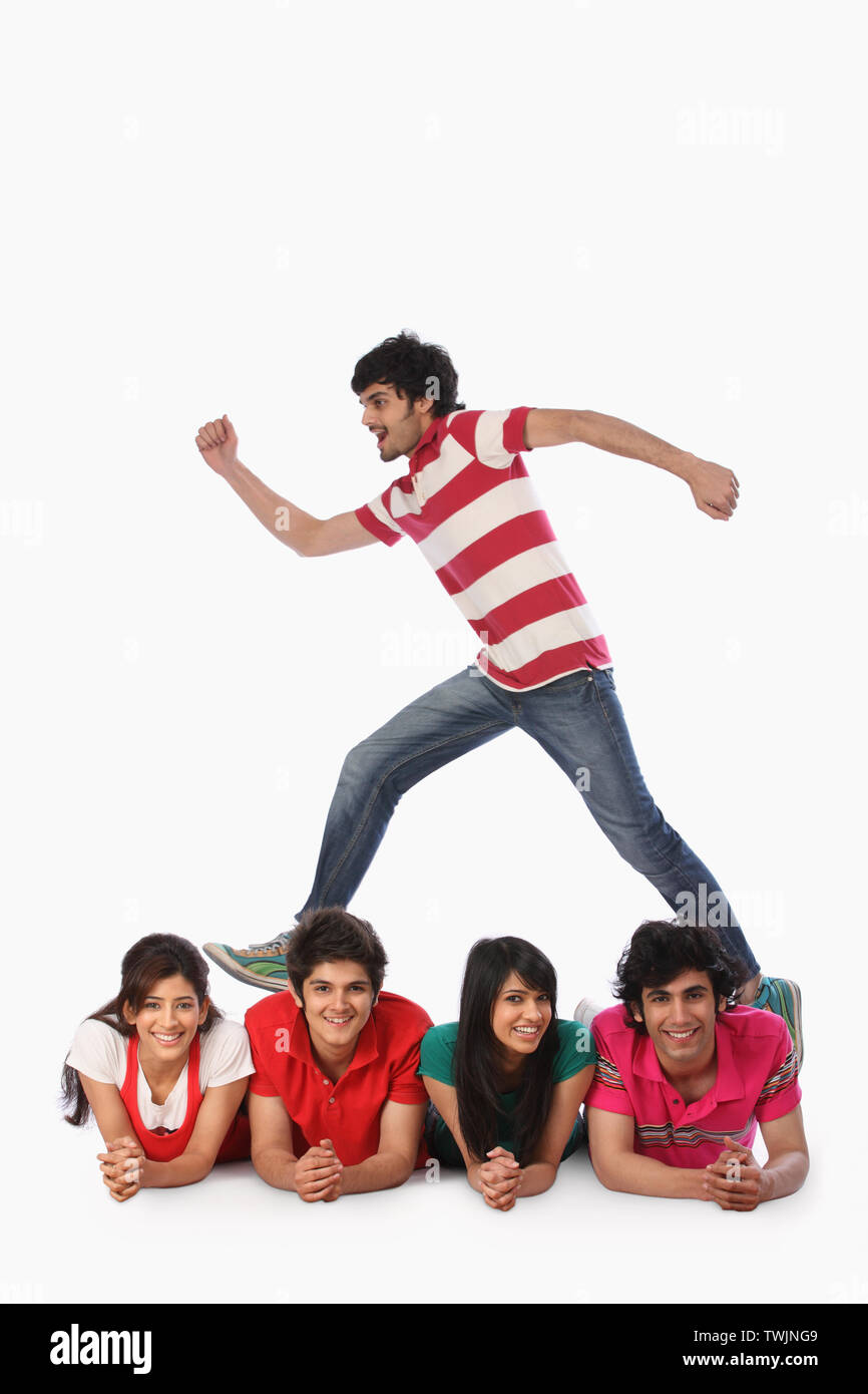 Jumping over 3 people hi-res stock photography and images - Alamy